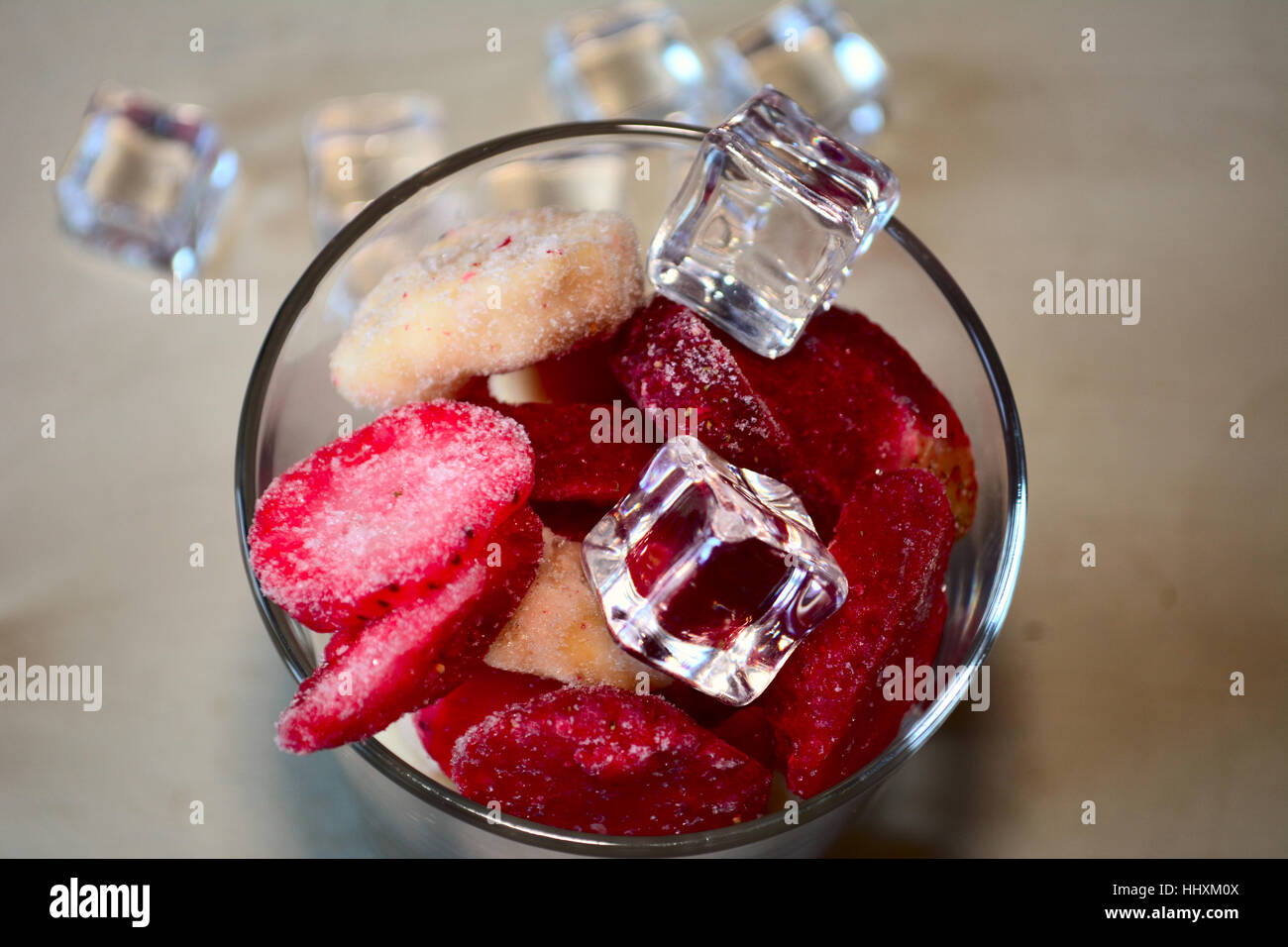 frozen strawberries in the glass with ice cubes Stock Photo - Alamy