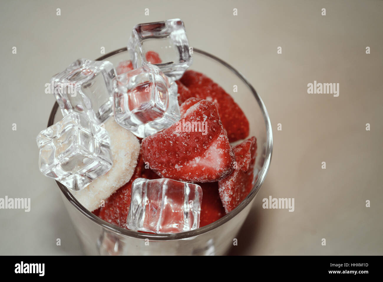 frozen strawberries in the glass with ice cubes Stock Photo - Alamy