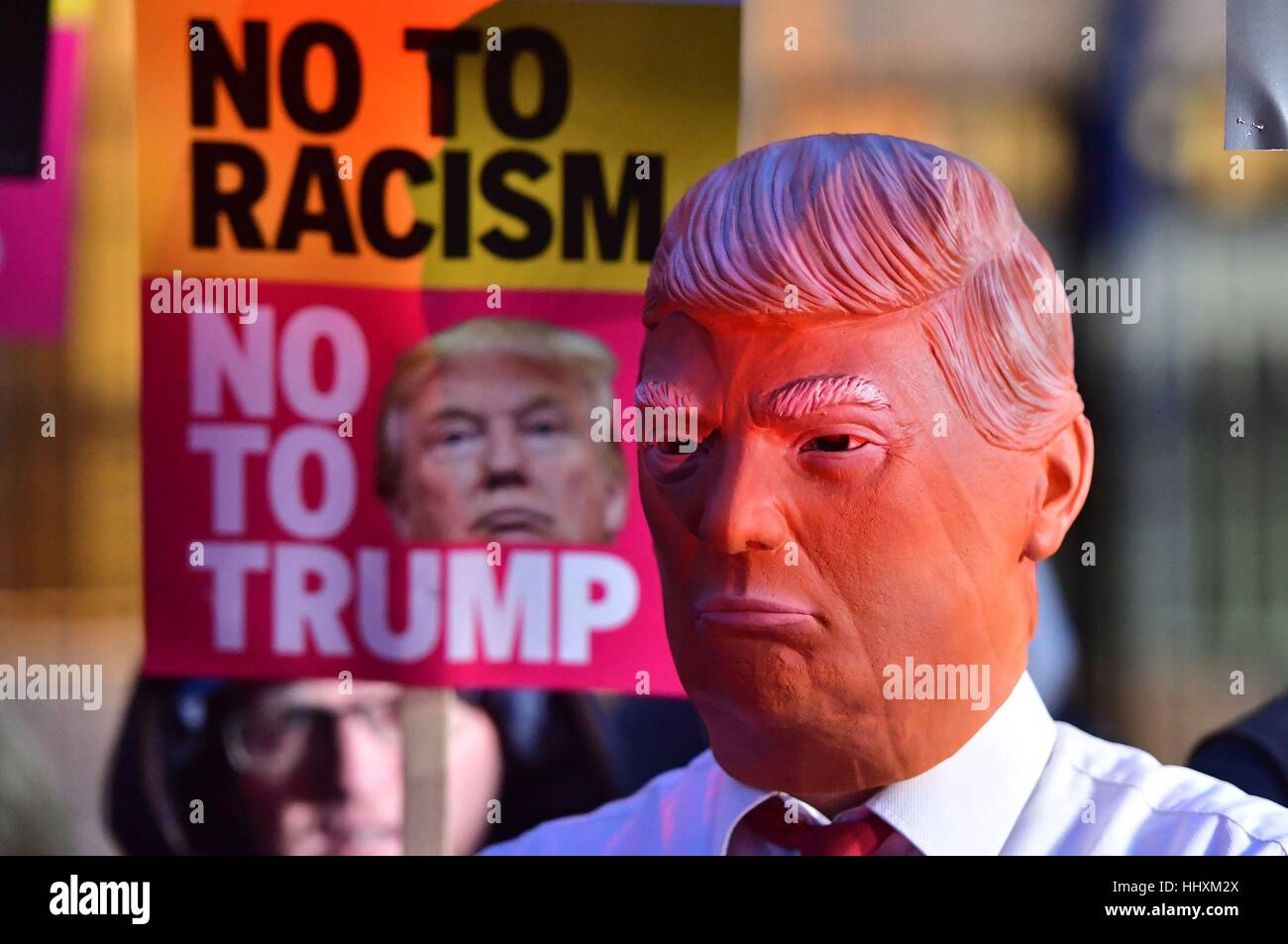 A campaigner with a Donald Trump mask outside the American Embassy in ...