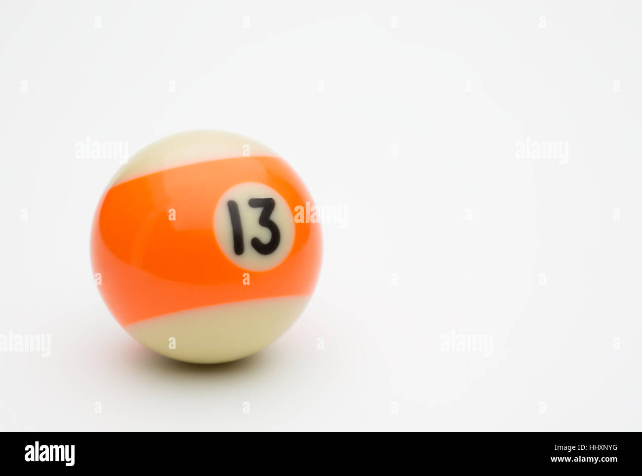 Number thirteen pool ball on a white background Stock Photo - Alamy