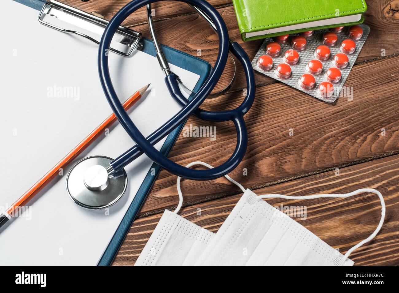 Desk of doctor with medicine things Stock Photo - Alamy