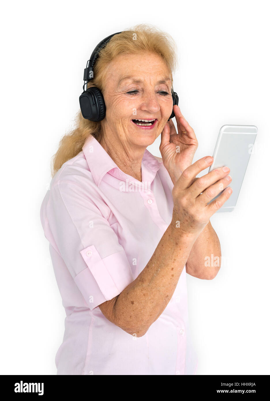 Senior Adult Use Mobile Headphone Concept Stock Photo - Alamy