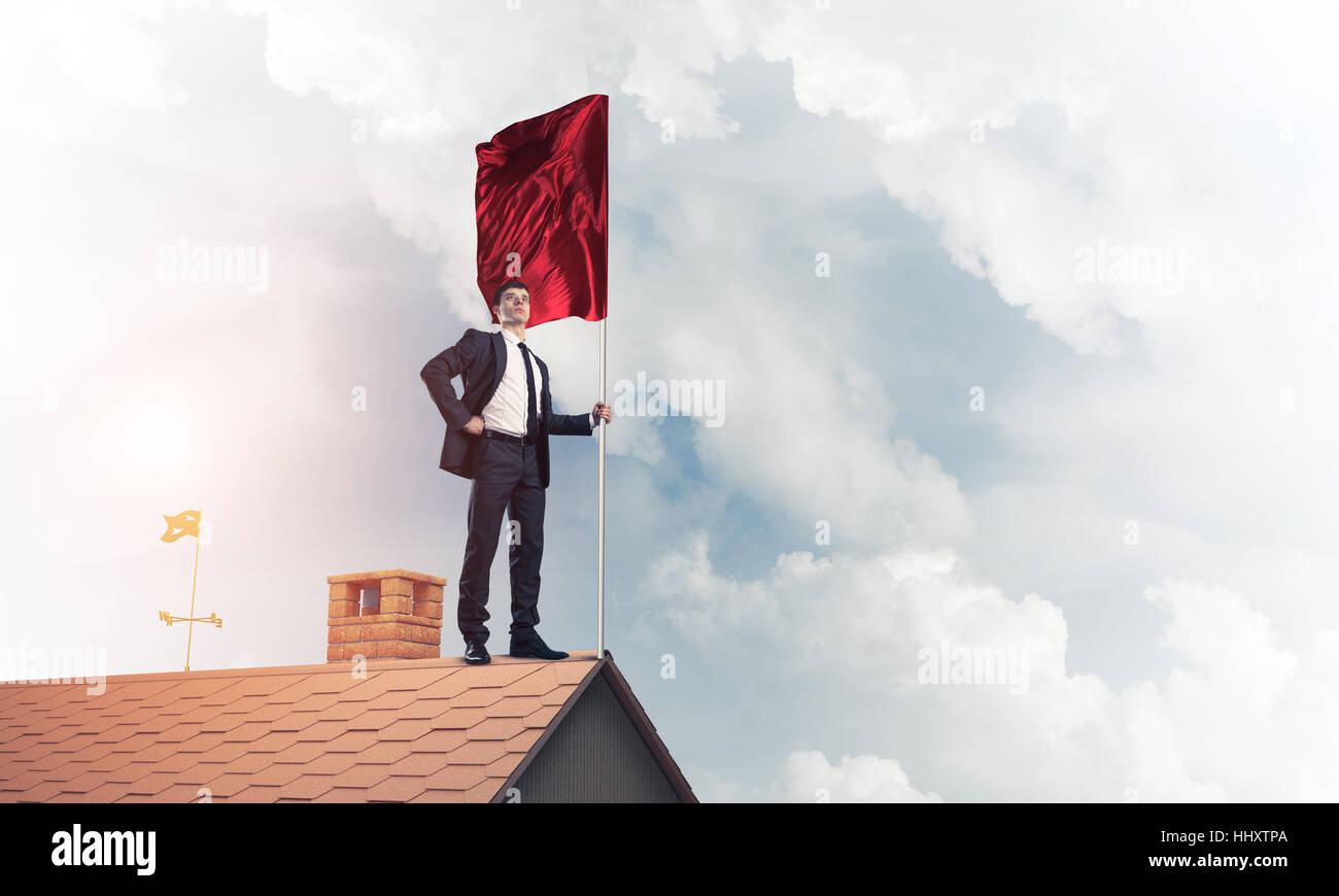 Young businessman with flag presenting concept of leadership. Mi Stock ...