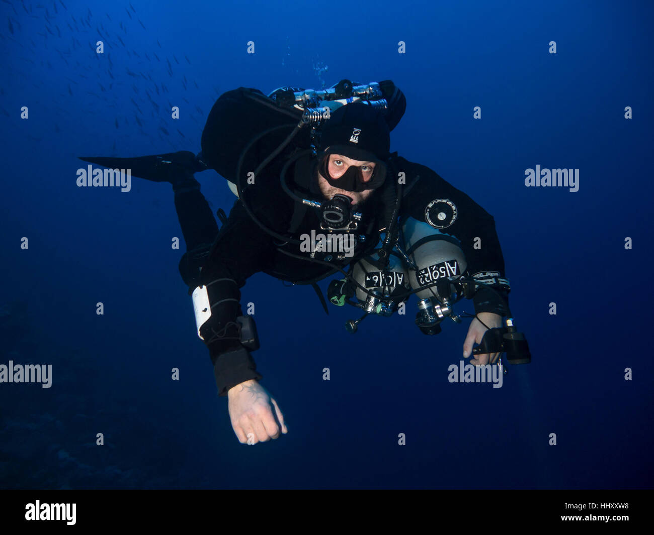 technical diver on dark blue background, front view Stock Photo - Alamy