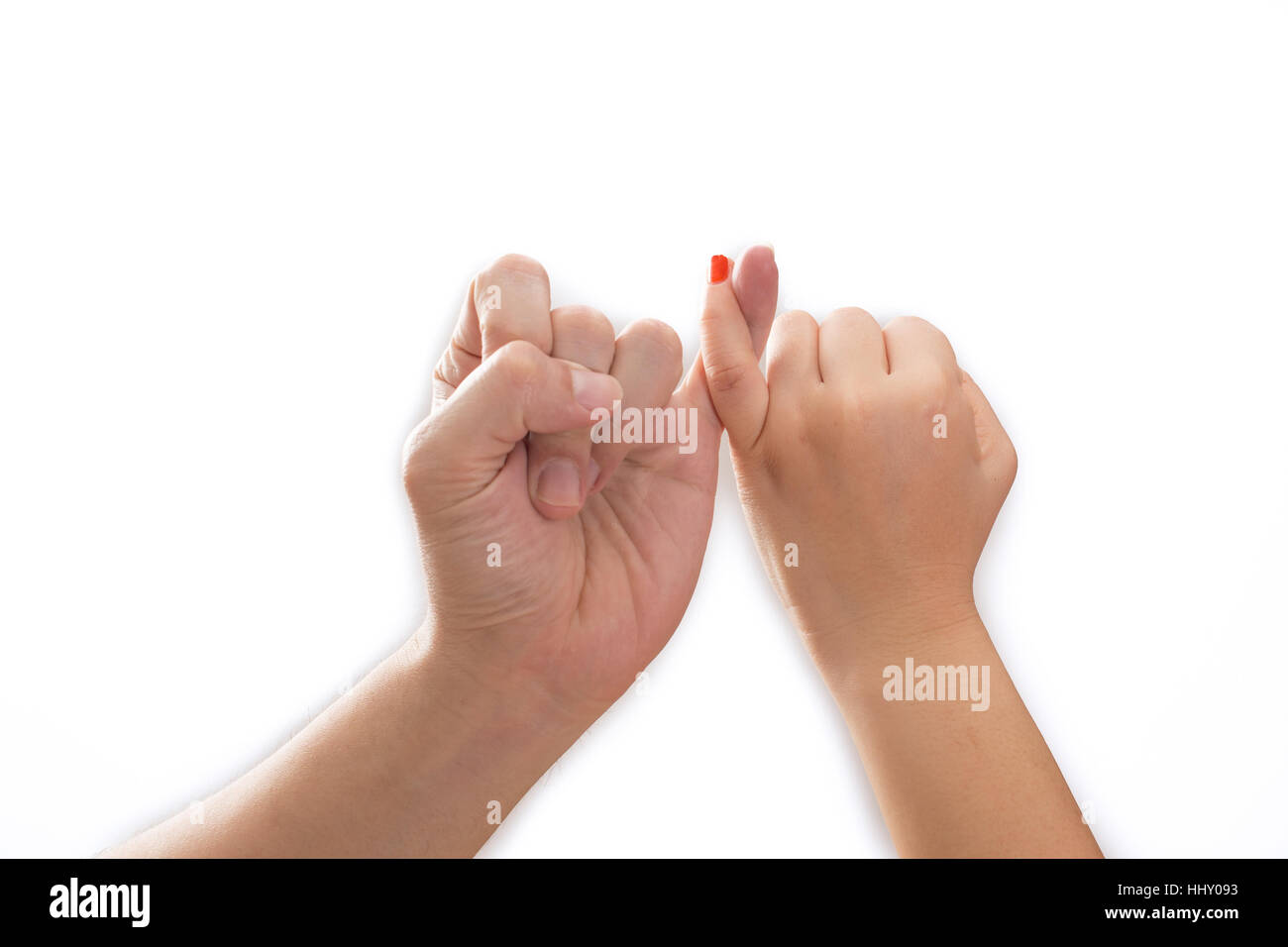 Man and woman making a pinkie symbol of promise isolated on white ...