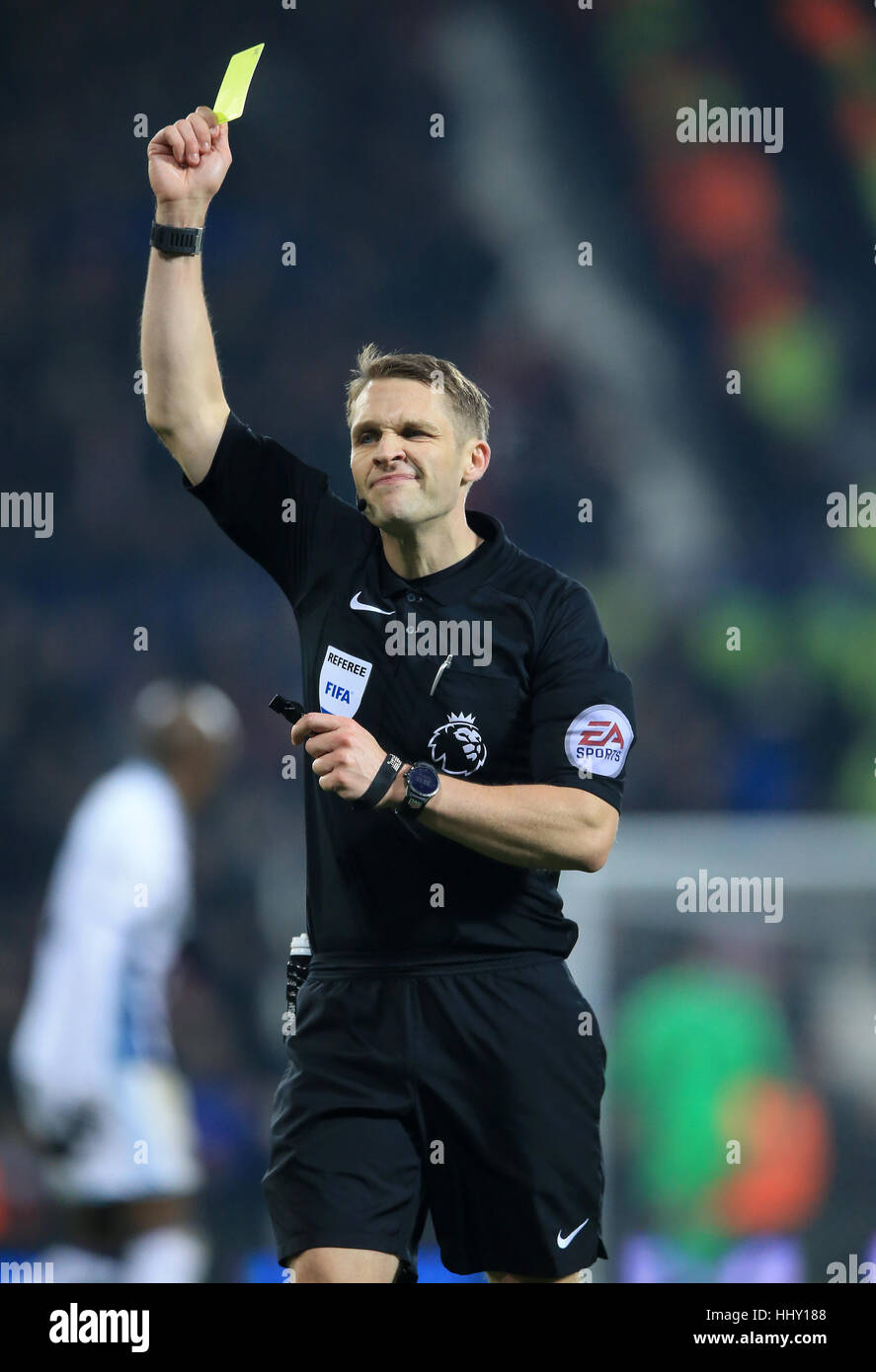 Referee craig pawson shows yellow card hi-res stock photography and images - Alamy