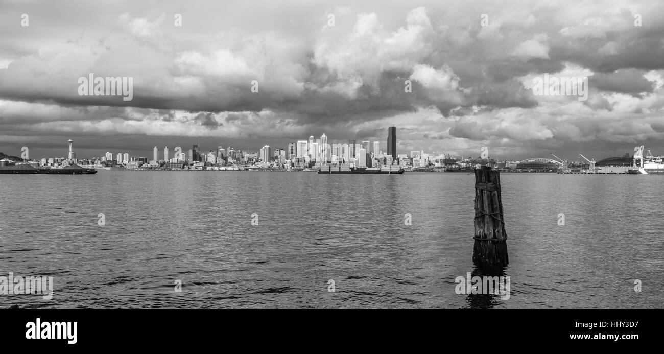 Billowing clouds hover over the Seattle skyline. Black and white image ...