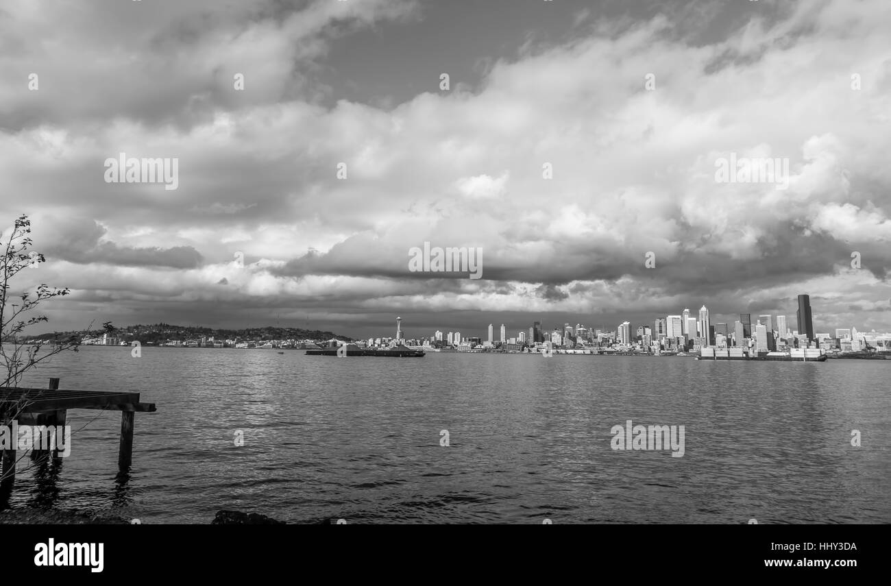 Billowing clouds hover over the Seattle skyline. Black and white image ...