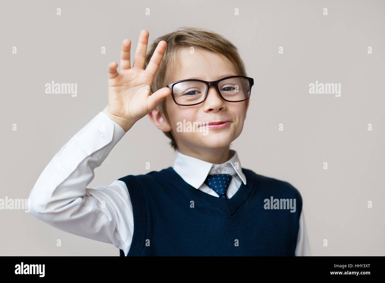 Funny child. Portrait of handsome smiling little smart schoolboy in ...