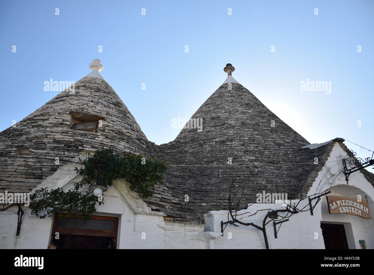 The beautiful town of Alberobello and its the traditional trulli houses ...
