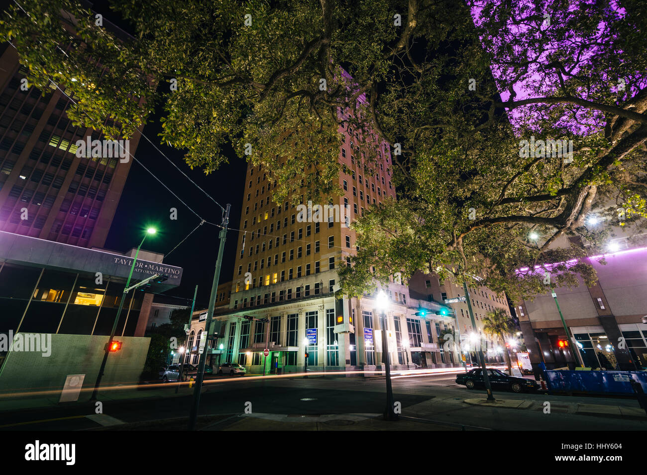 Buildings and intersection at night, in Mobile, Alabama Stock Photo - Alamy