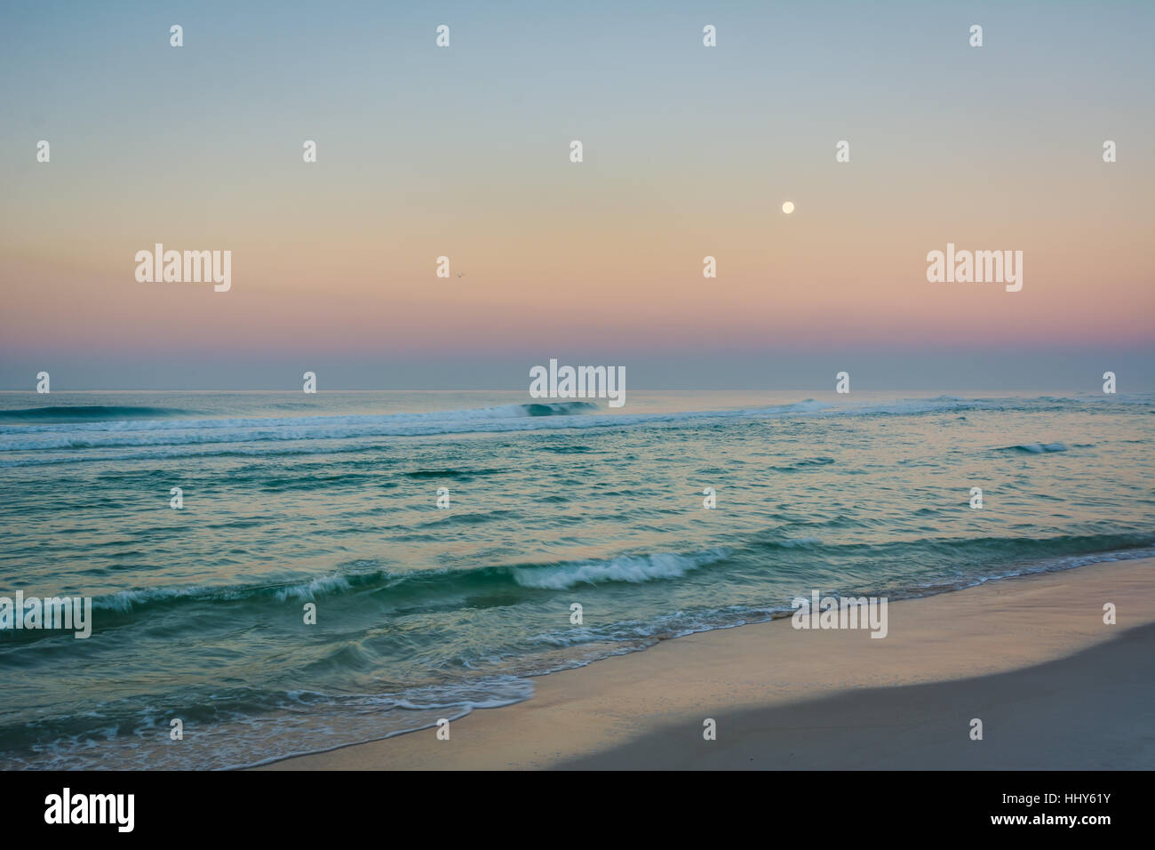 Moon over the Gulf of Mexico at sunrise, in Panama City Beach, Florida ...