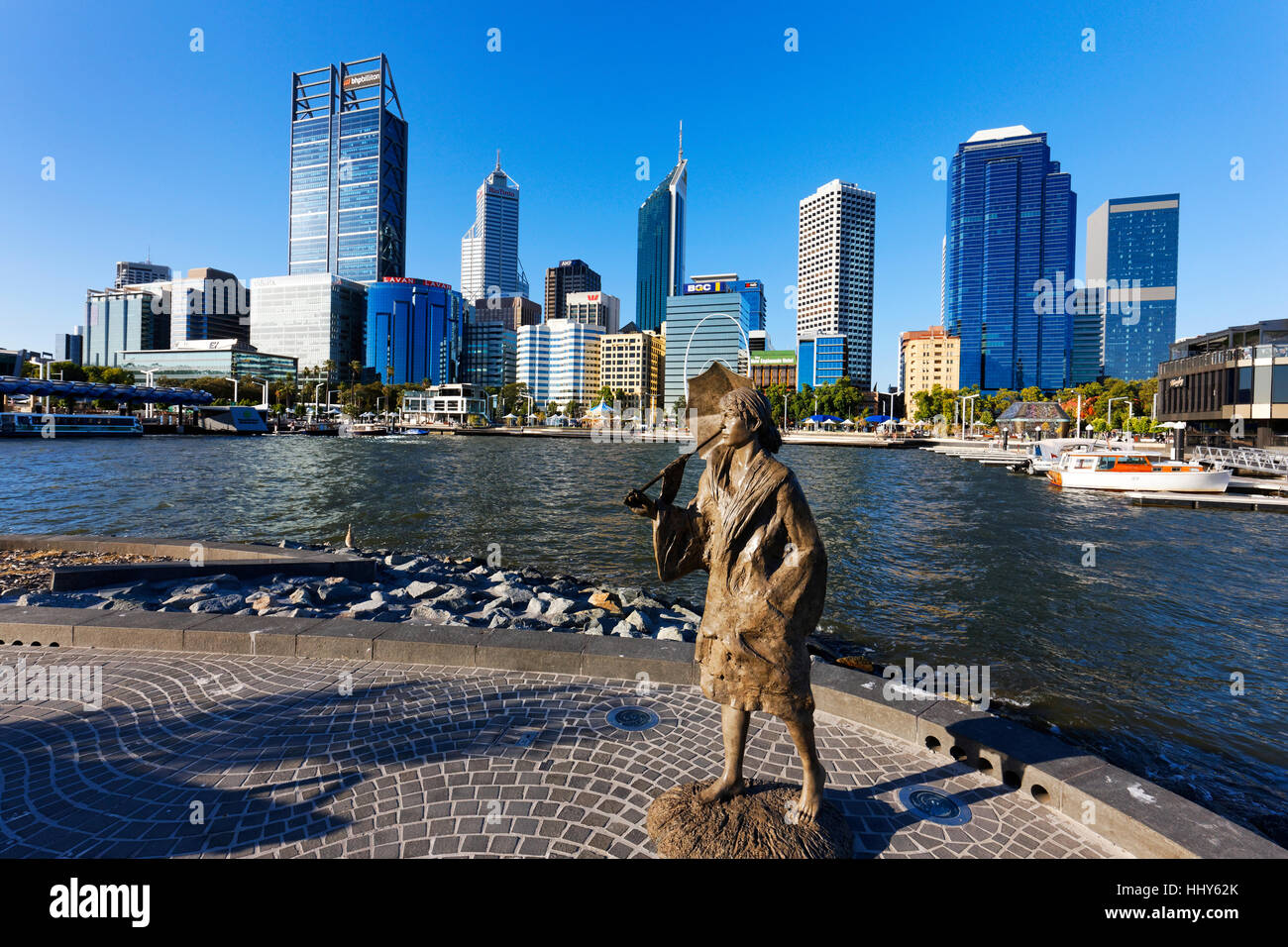 Western australia sculpture of a woman with city skyline hi-res stock ...