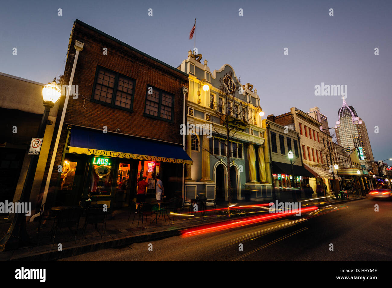 Traffic and buildings on Dauphin Street at night, in Mobile, Alabama ...