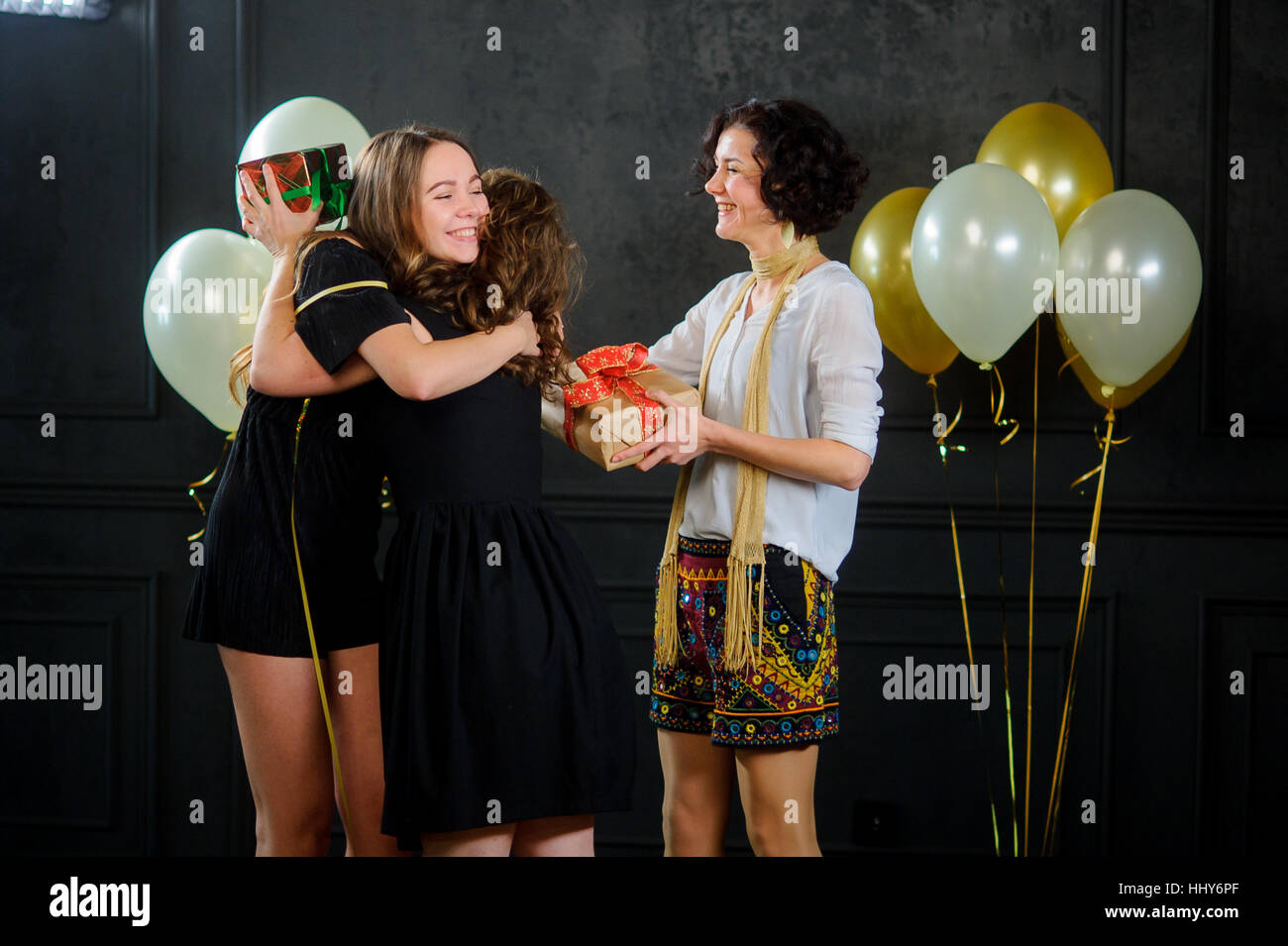 The girl receives congratulations and gifts from girlfriends. The room ...