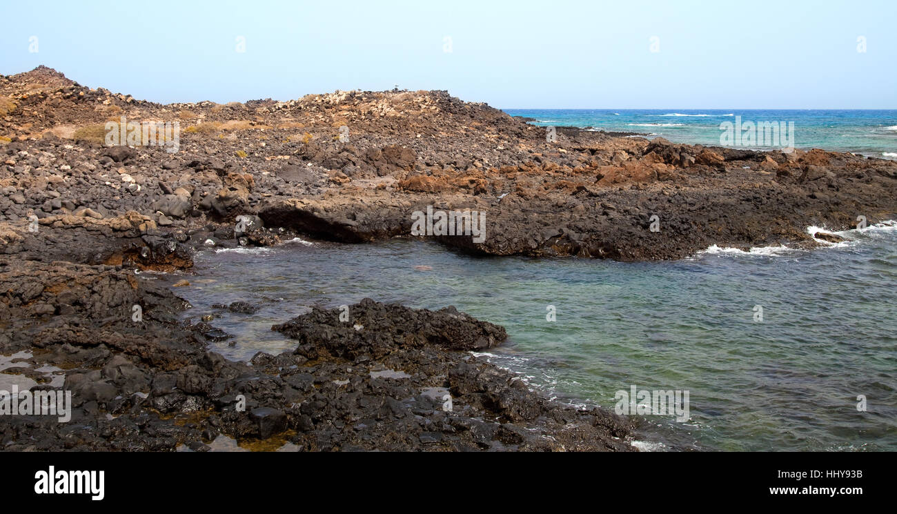 volcanic rocks on the beach Stock Photo - Alamy