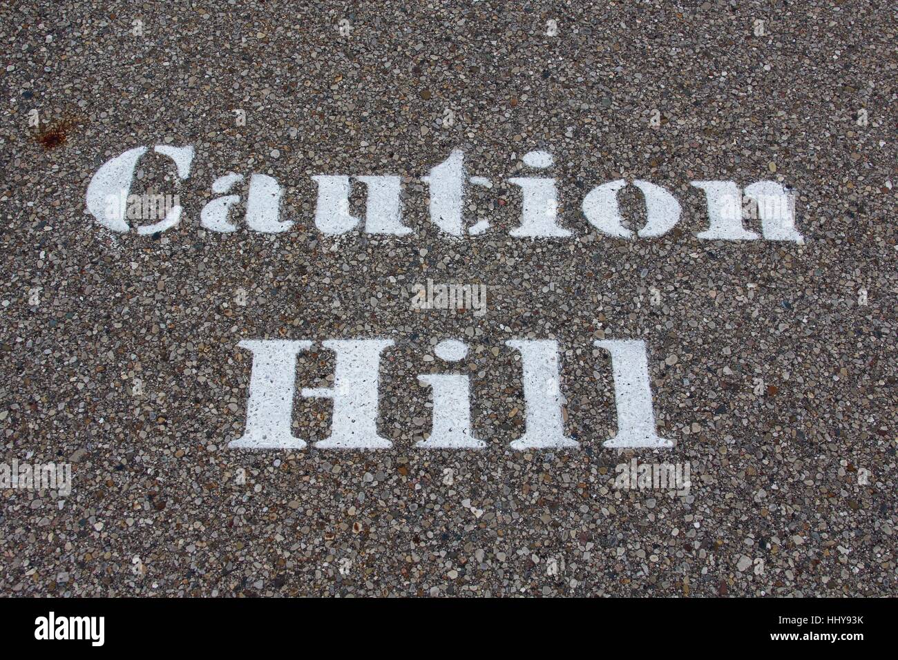 Caution Hill painted on the walkway on a close up view Stock Photo - Alamy