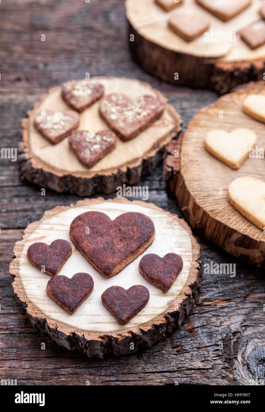 Delicious heart shaped cookies baked with love on wooden background ...