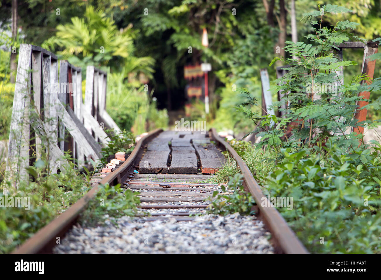 old railway track with a railing on the bridge Stock Photo - Alamy