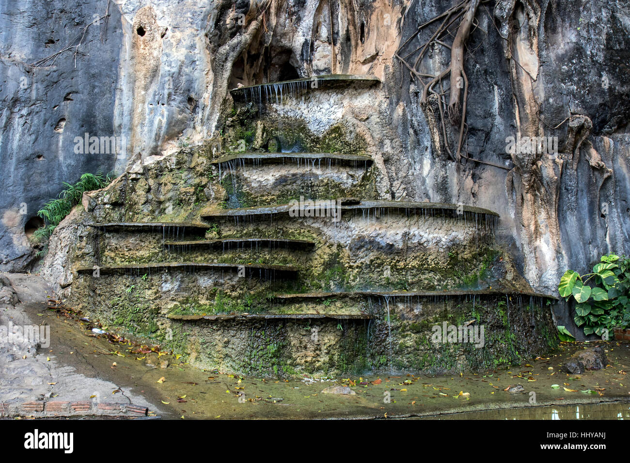 Water flows out of the cave after carved steps Stock Photo - Alamy