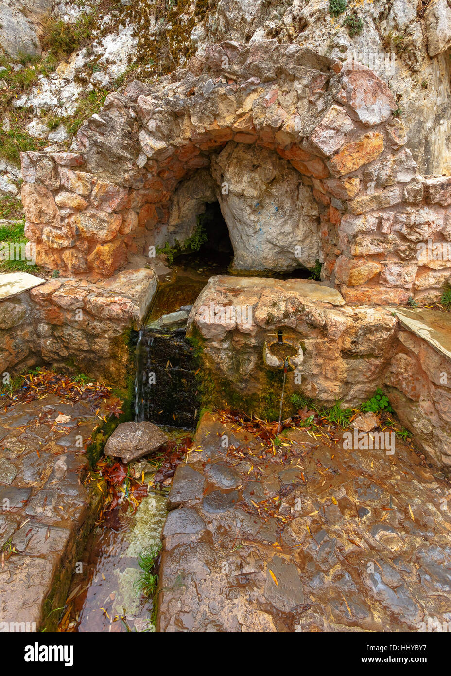 Building details in park with natural water springs, stone decorations ...