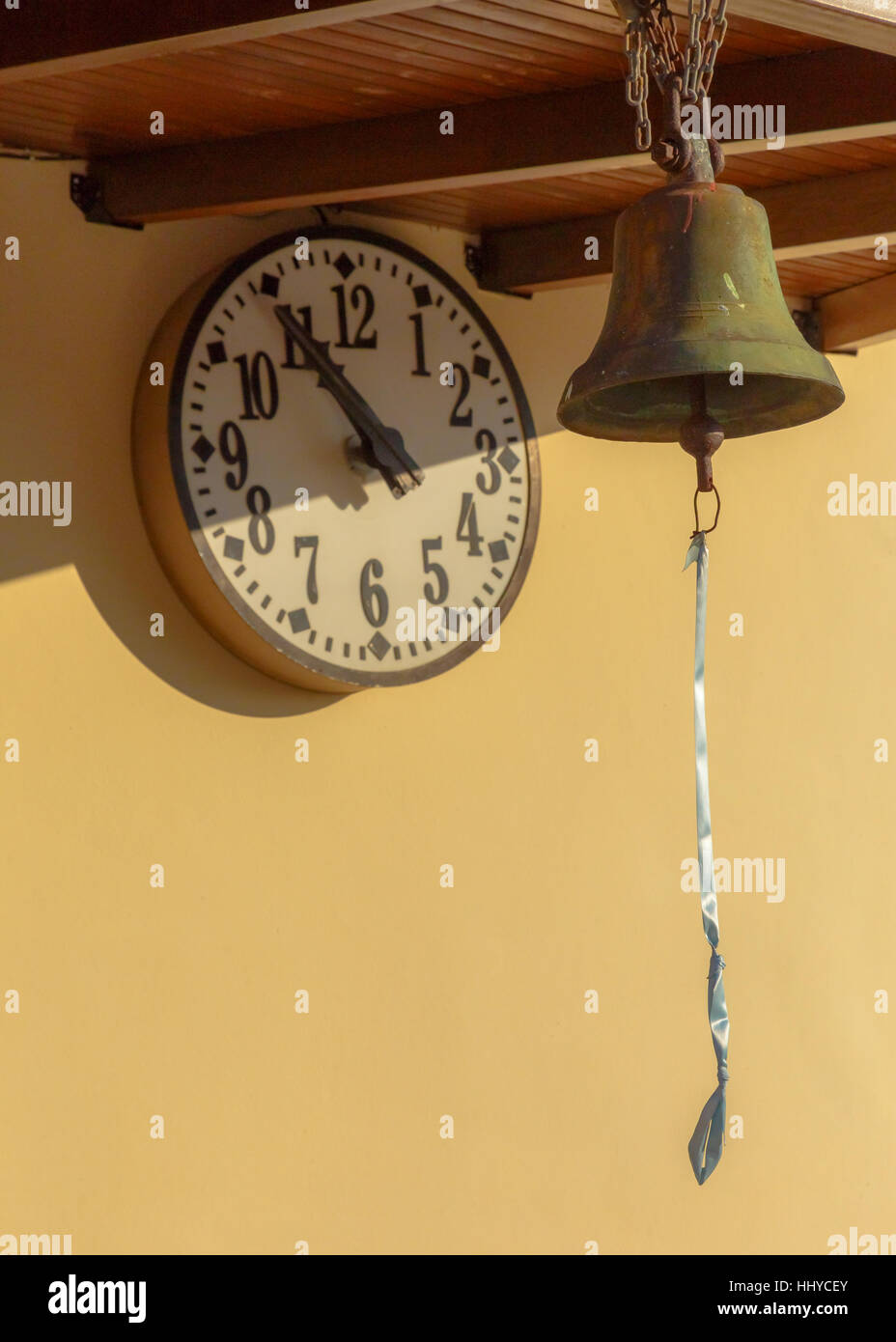 Church bell and wall clock inside monastery in Greece Stock Photo - Alamy