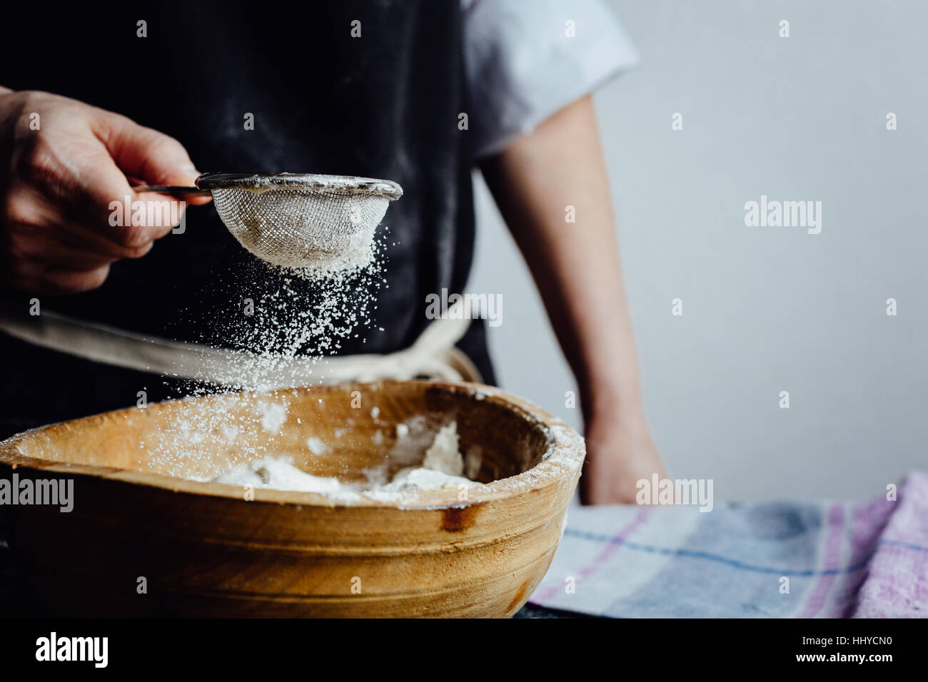 Person covering pastry with flour Stock Photo - Alamy