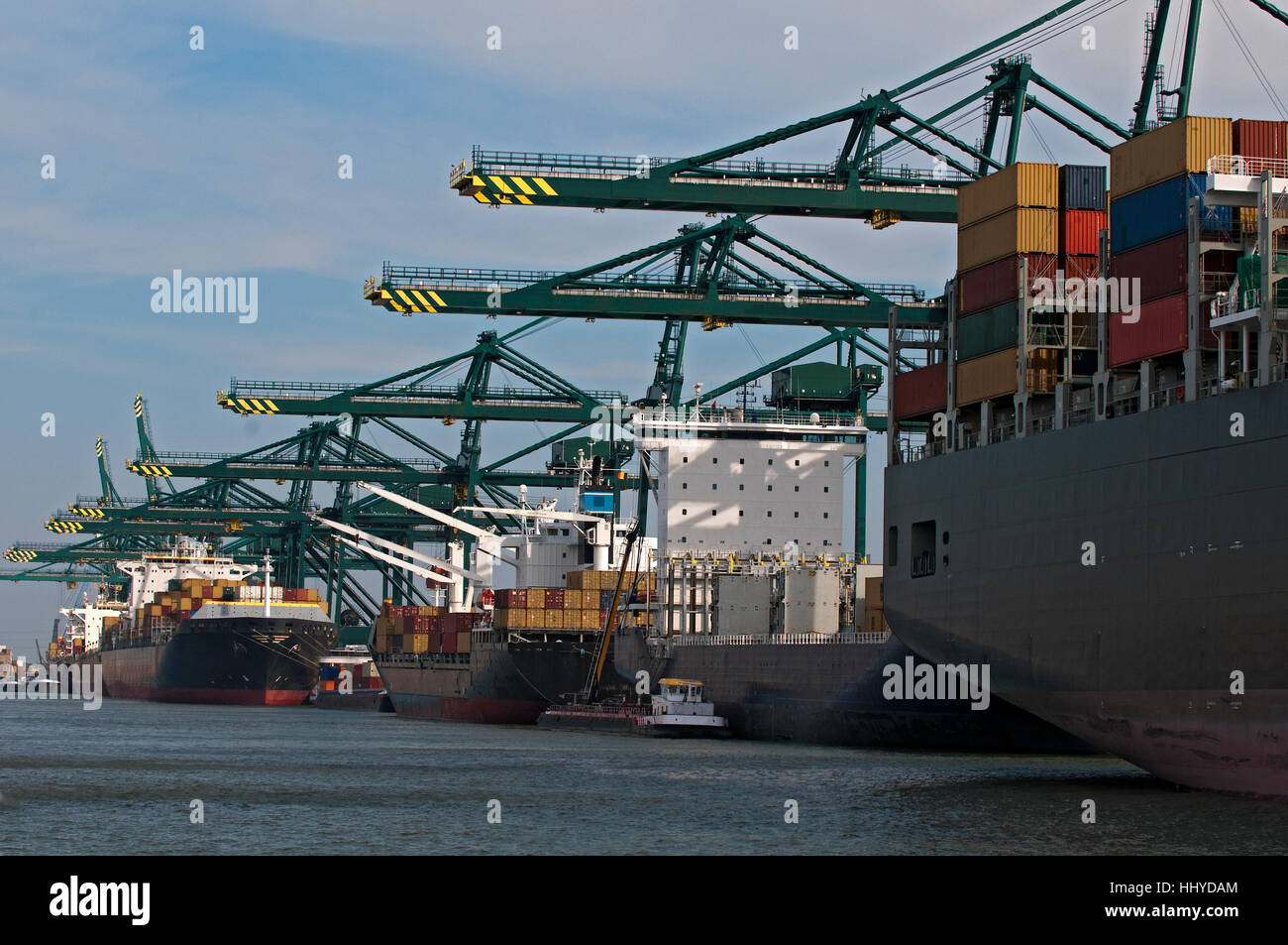 container ship unloading in a harbor Stock Photo - Alamy