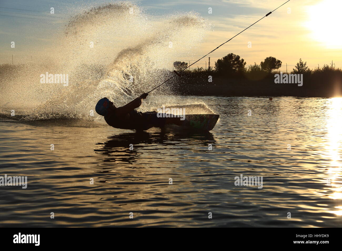 Sunset wakeboarding session in Alpipark Stock Photo - Alamy