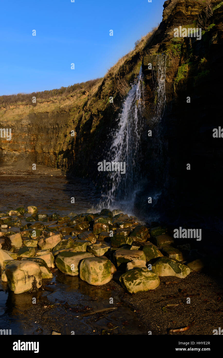 Waterfall over cliffs, Kimmeridge Bay, Dorset, UK Stock Photo - Alamy