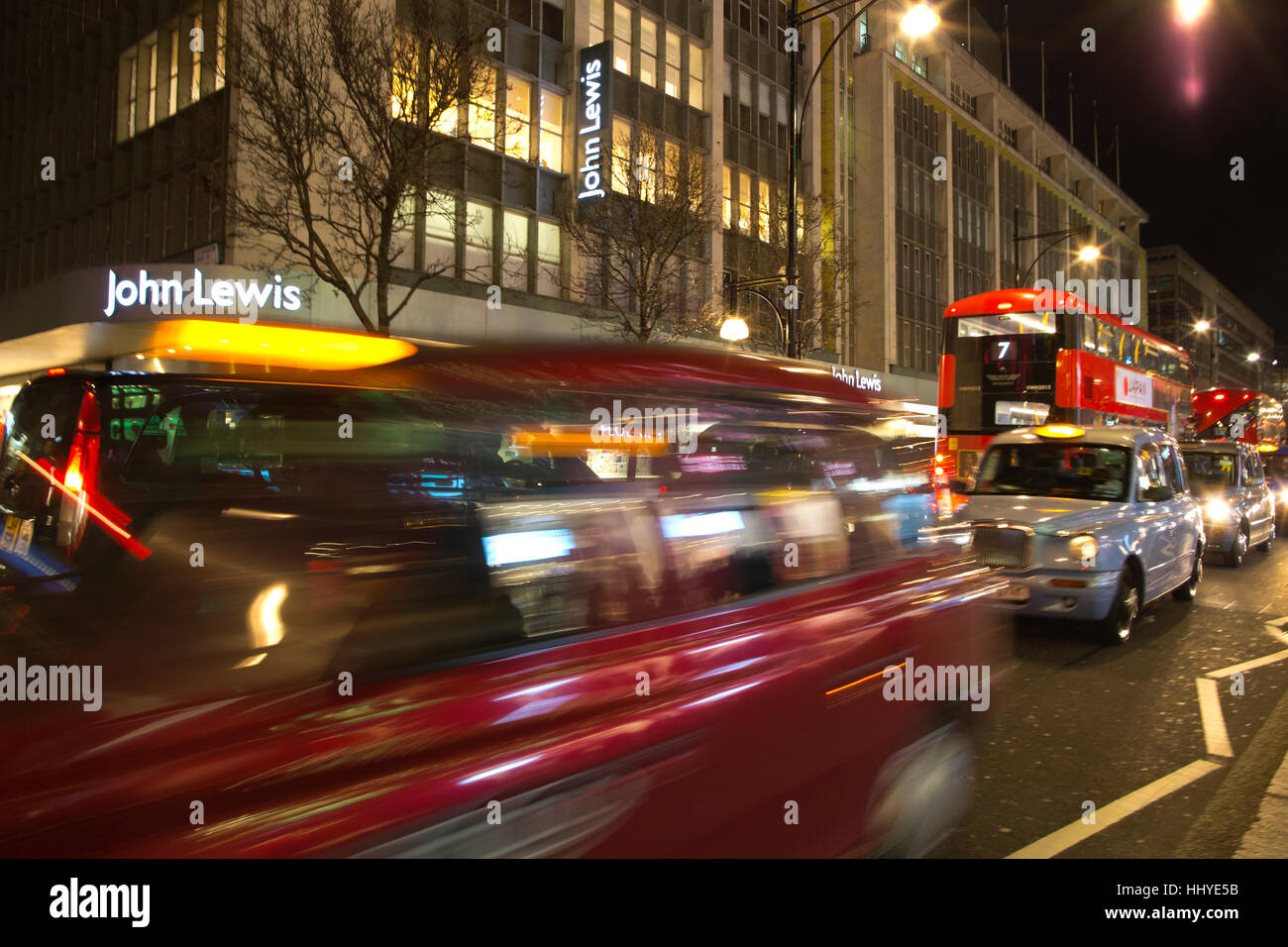 Taxis and buses outside John Lewis department store on Oxford Street ...