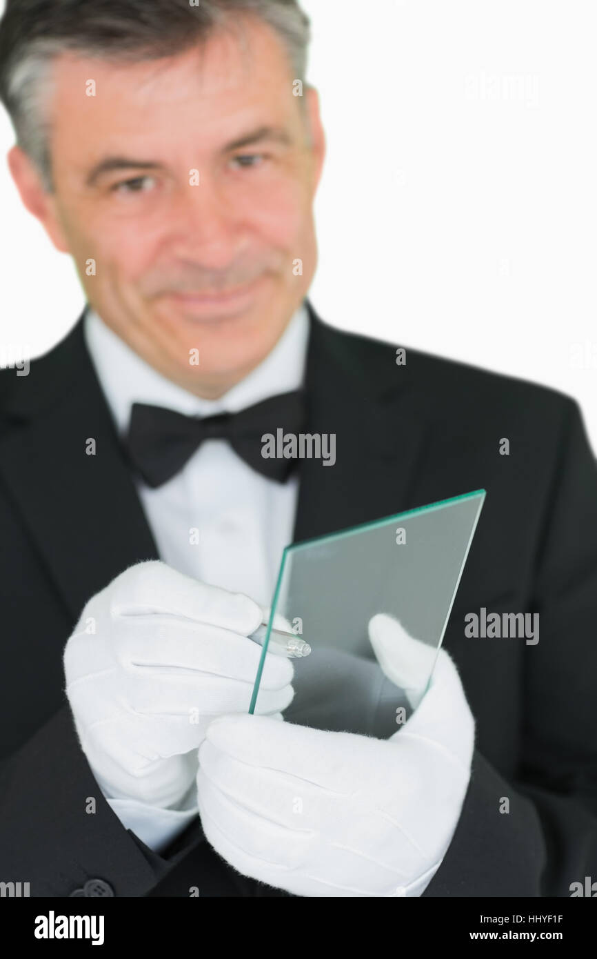 Smiling waiter using virtual screen to take orders Stock Photo - Alamy