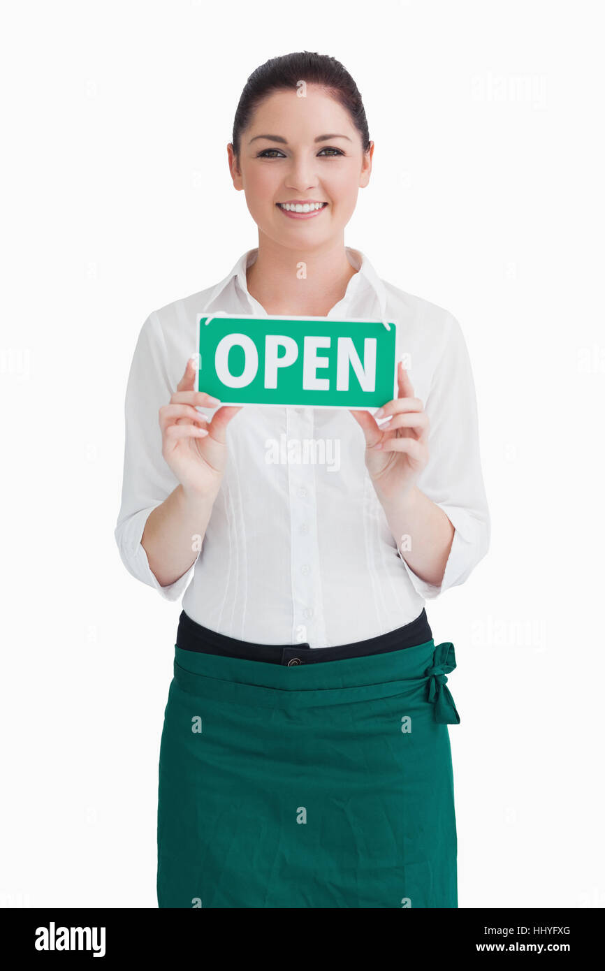 Smiling waitress holding green open sign Stock Photo - Alamy