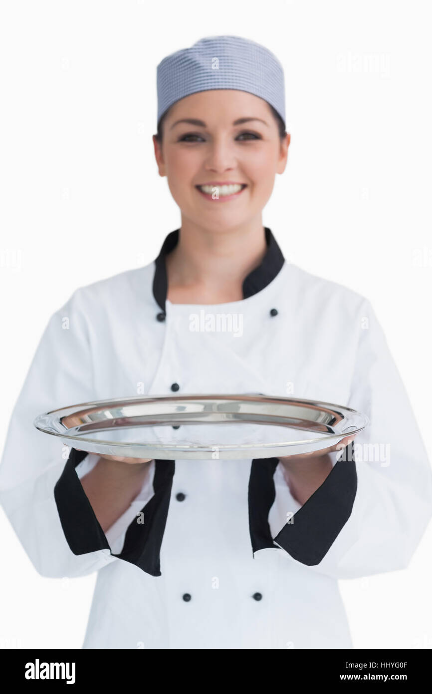 Happy chef holding an empty silver tray on a white background Stock ...