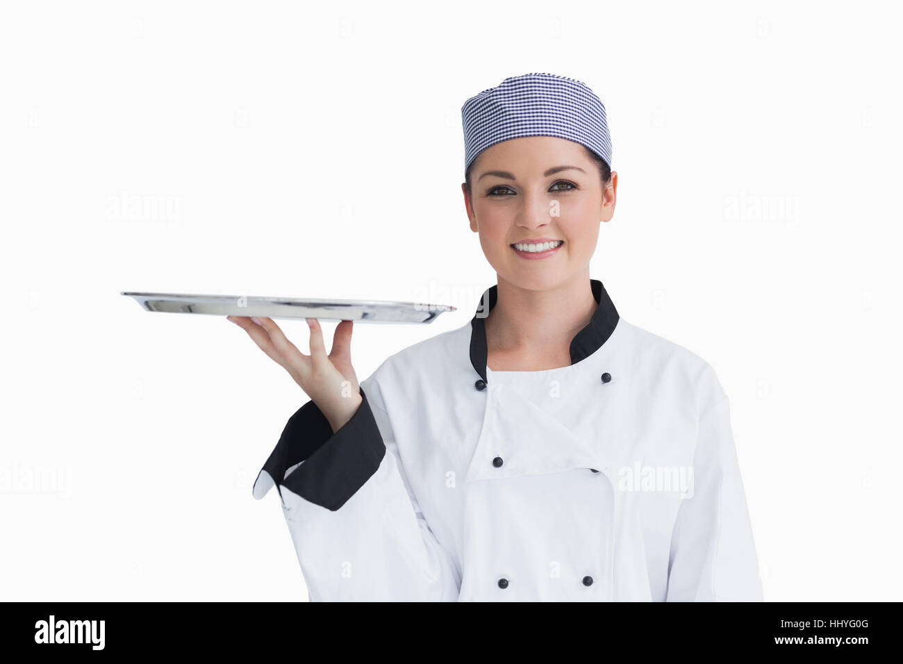 Chef holding an empty silver tray on a white background Stock Photo - Alamy