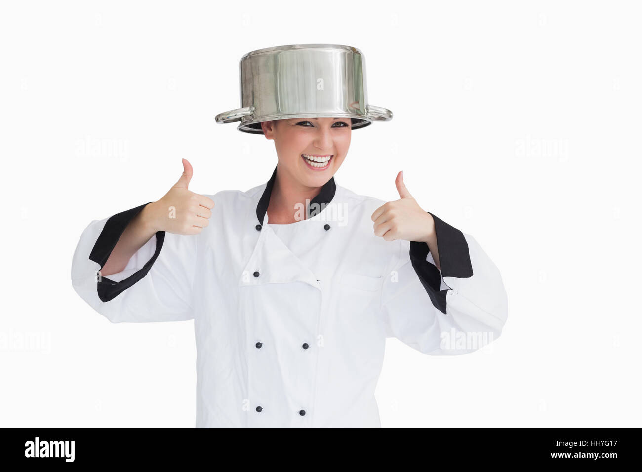 Cook having fun with a pot on her head and giving thumbs up Stock Photo ...