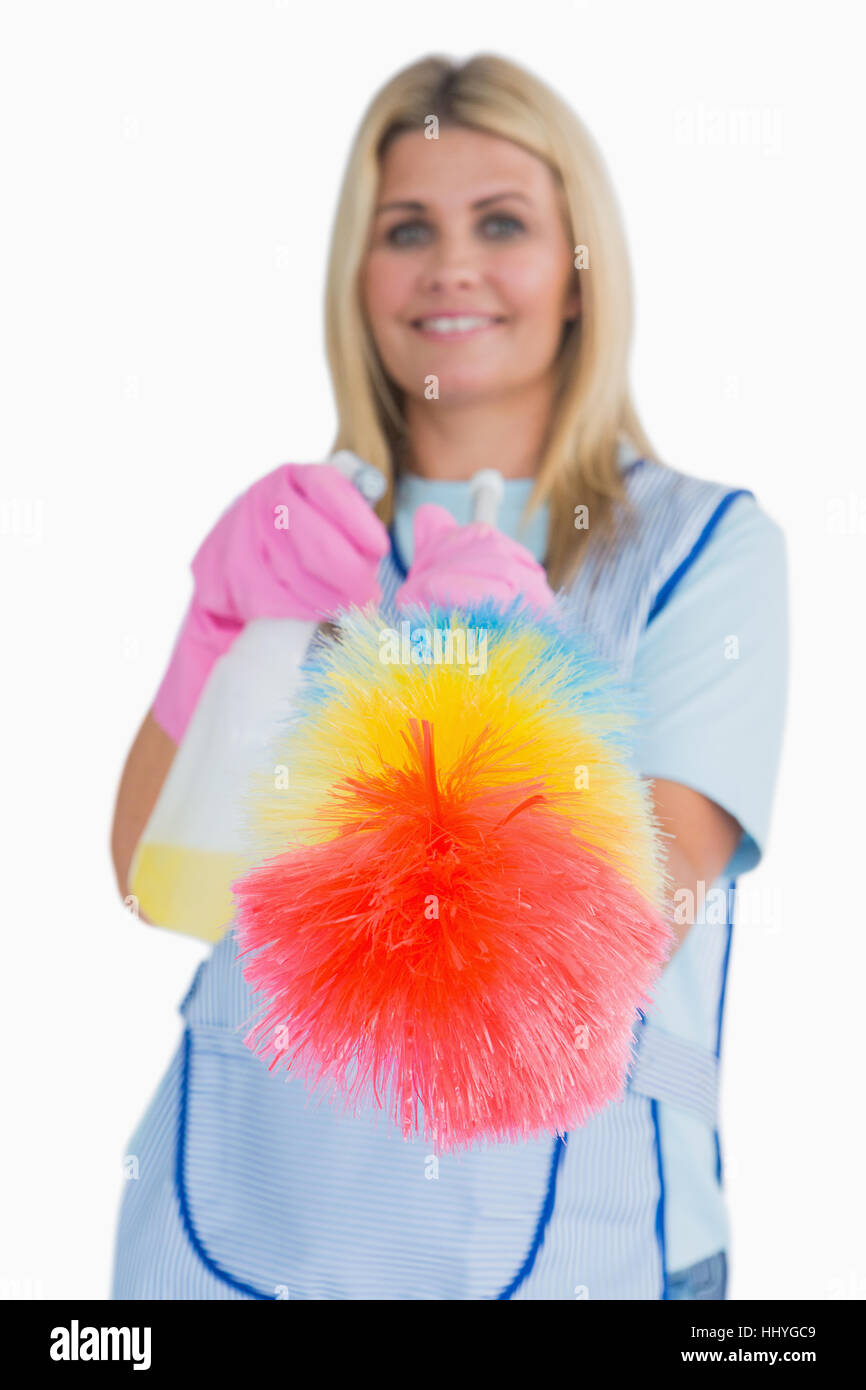 Cleaner holding feather duster in the white background Stock Photo - Alamy