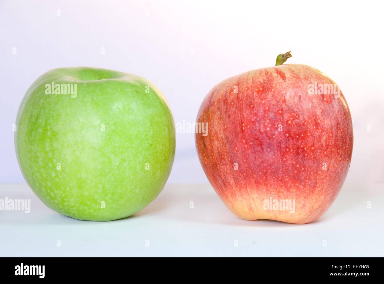 one green and one red apple, on white Stock Photo - Alamy