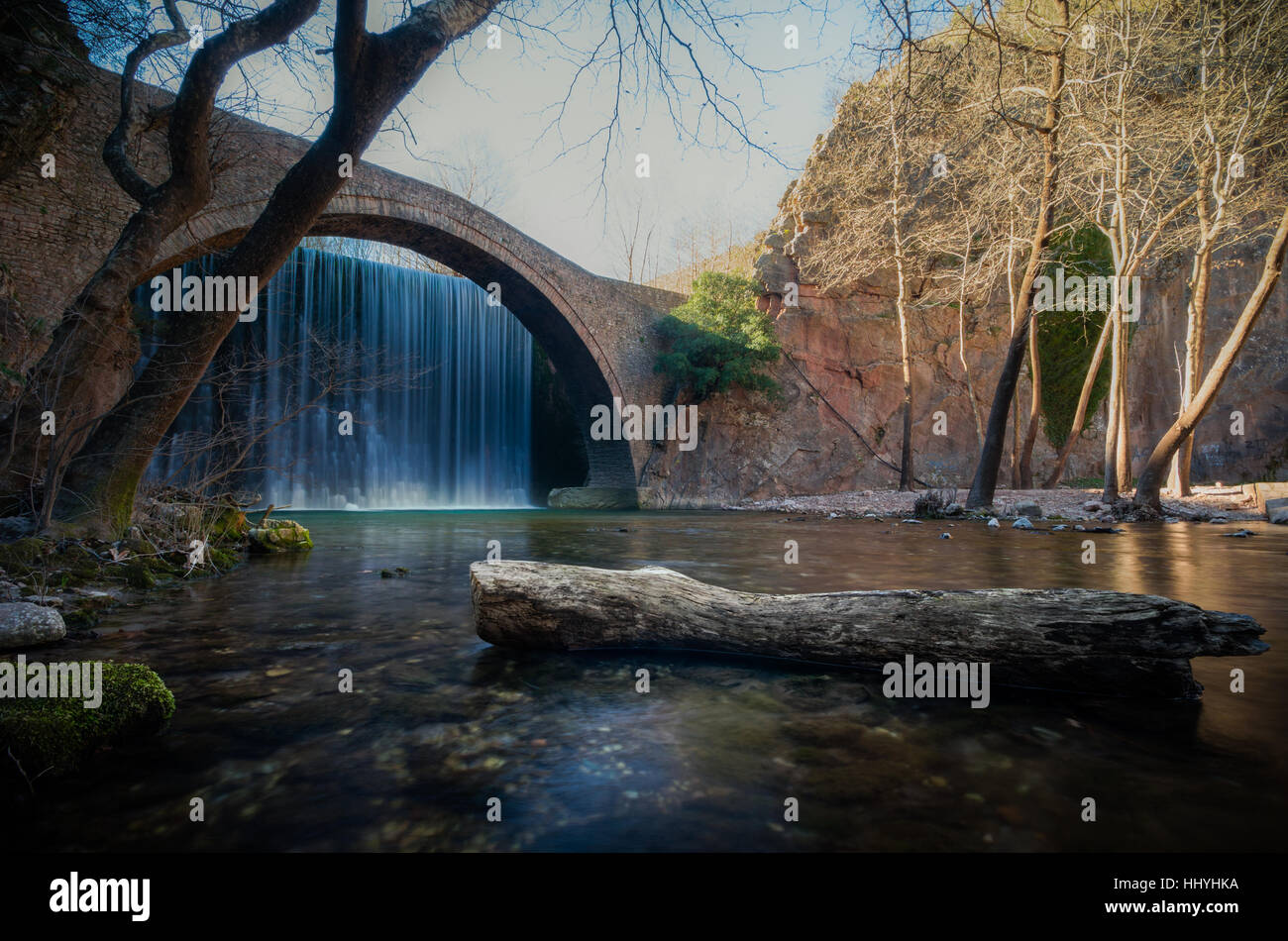 Paleokarya, old, stone, arched bridge, between two waterfalls. Trikala ...