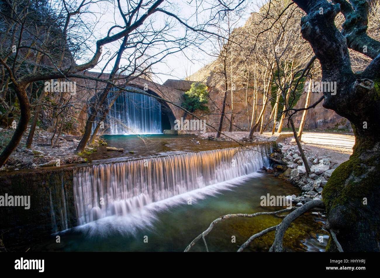 Paleokarya, old, stone, arched bridge, between two waterfalls. Trikala ...