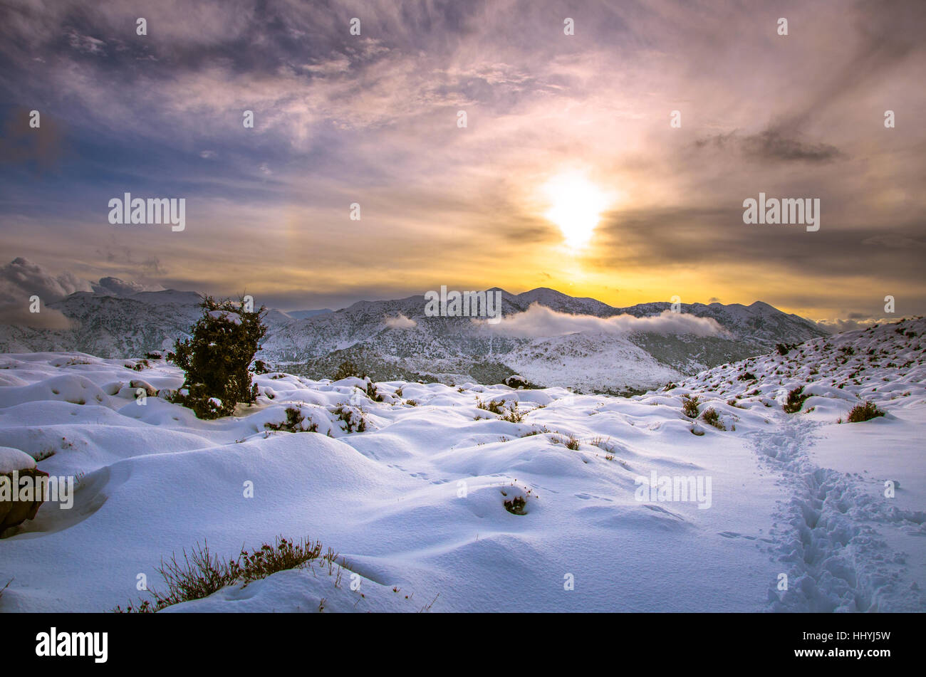 Winter landscape with snow, clouds and sunset, Neapoli, Crete Stock ...