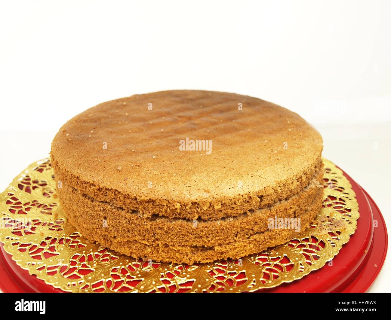Chocolate layer cake, in slices, isolated on a golden paper Stock Photo ...