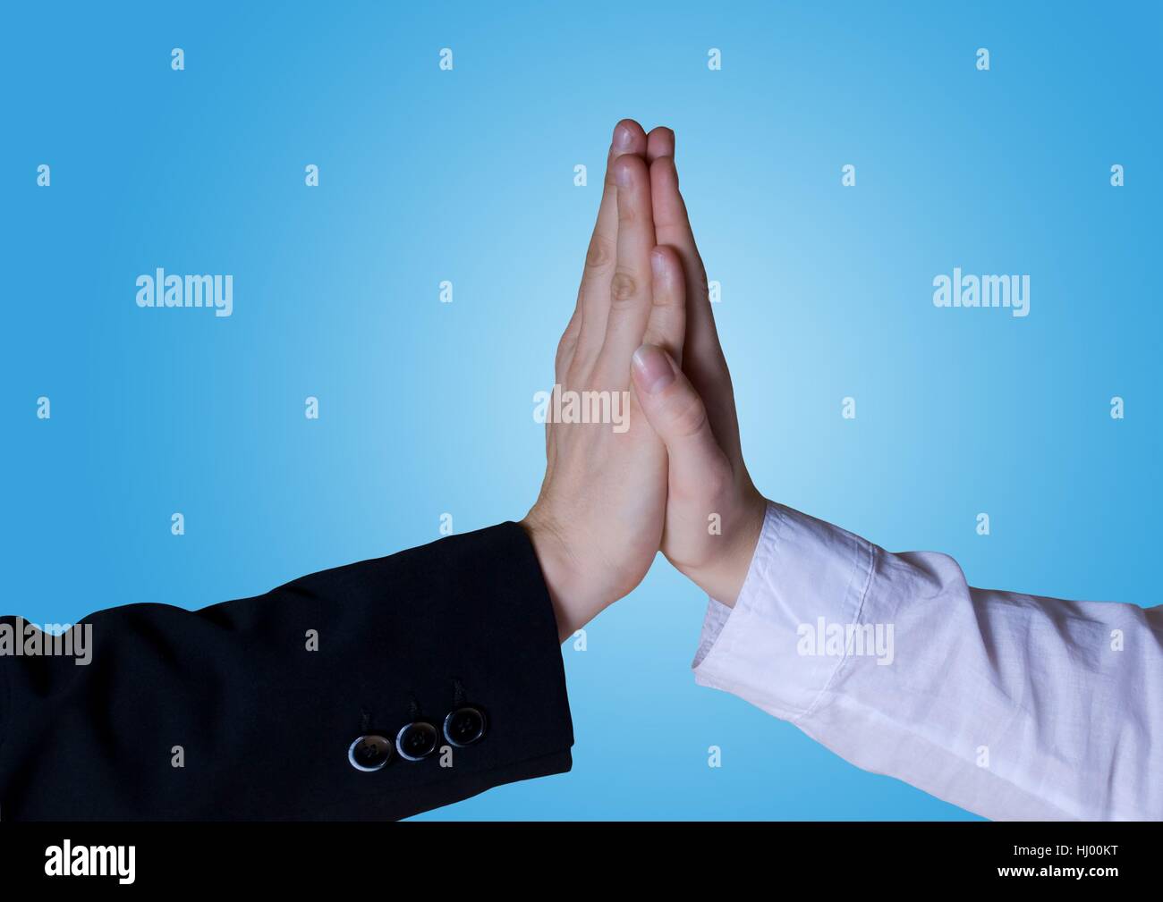 two business hands symbolizing success with blue background Stock Photo ...