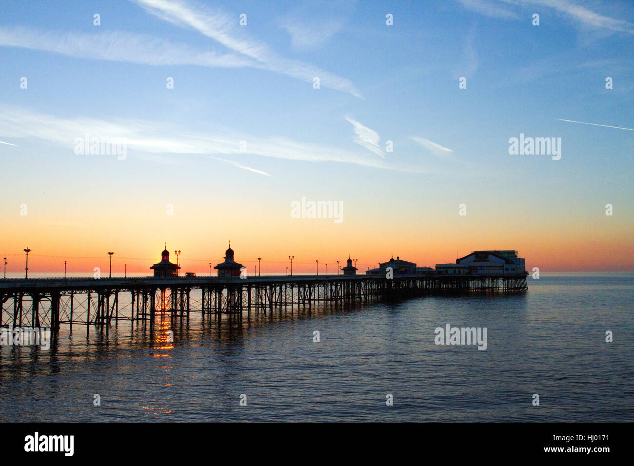 Evening sunset over Blackpools North Pier at high tide; A Victorian ...