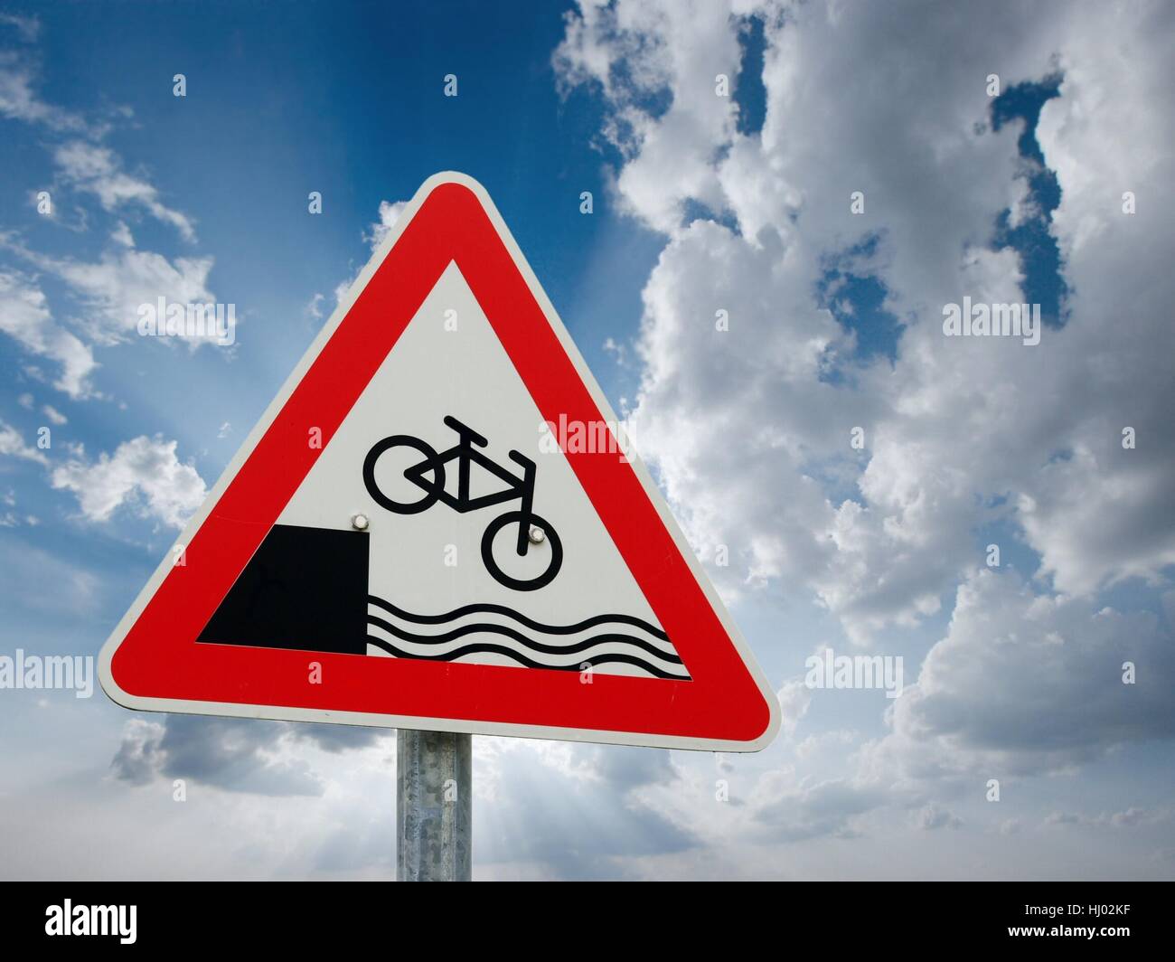 Traffic sign showing a bicycle falling down into the waves Stock Photo ...