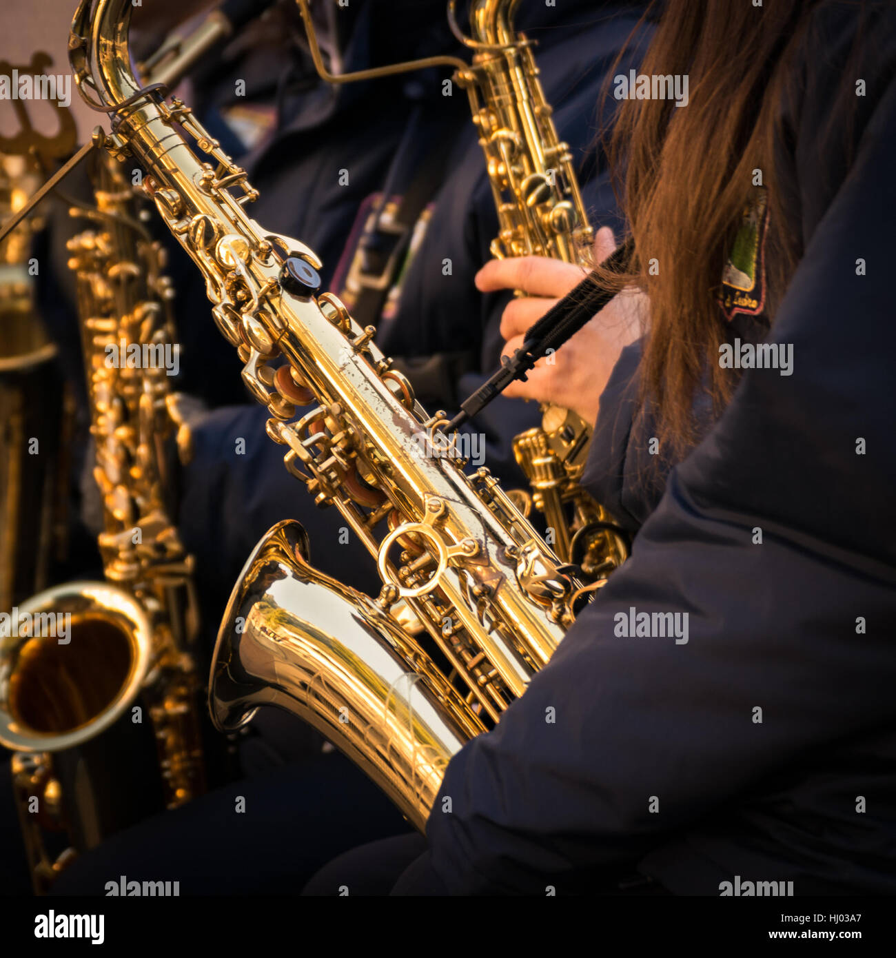 Saxophones of a town band during a performance Stock Photo - Alamy