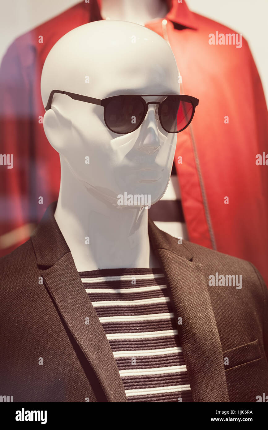 male dolls for display clothing in shop, note shallow depth of field ...