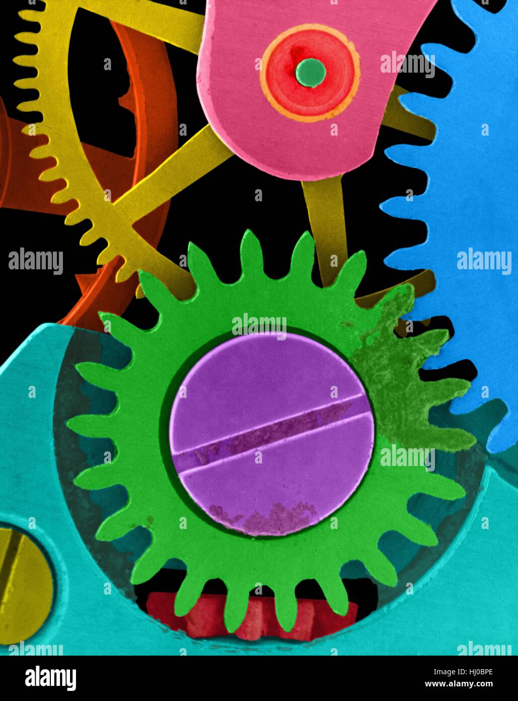 Coloured scanning electron micrograph (SEM) of Watch cogs and gears ...