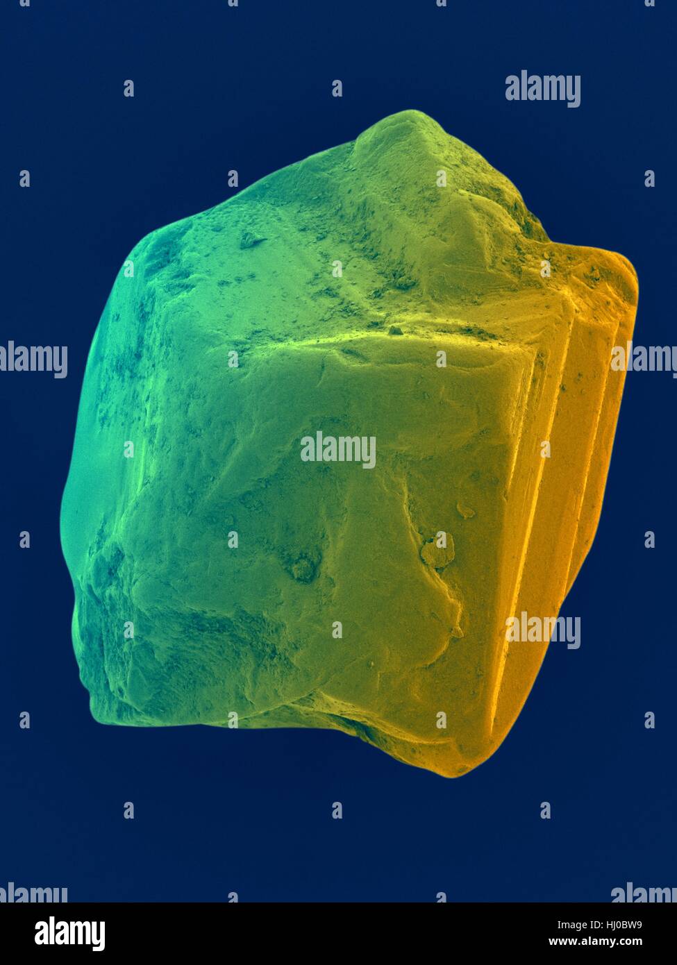 Coloured scanning electron micrograph (SEM) of an uncut sapphire ...