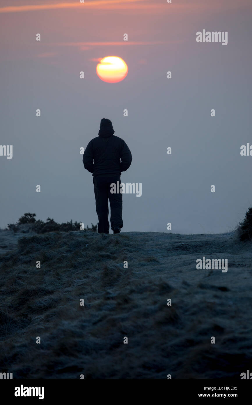 A hill walker braves the freezing temperatures on the ancient hill fort ...